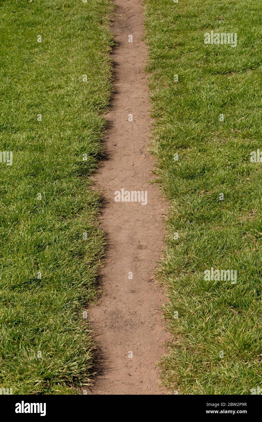 A worn path through a field Stock Photo - Alamy