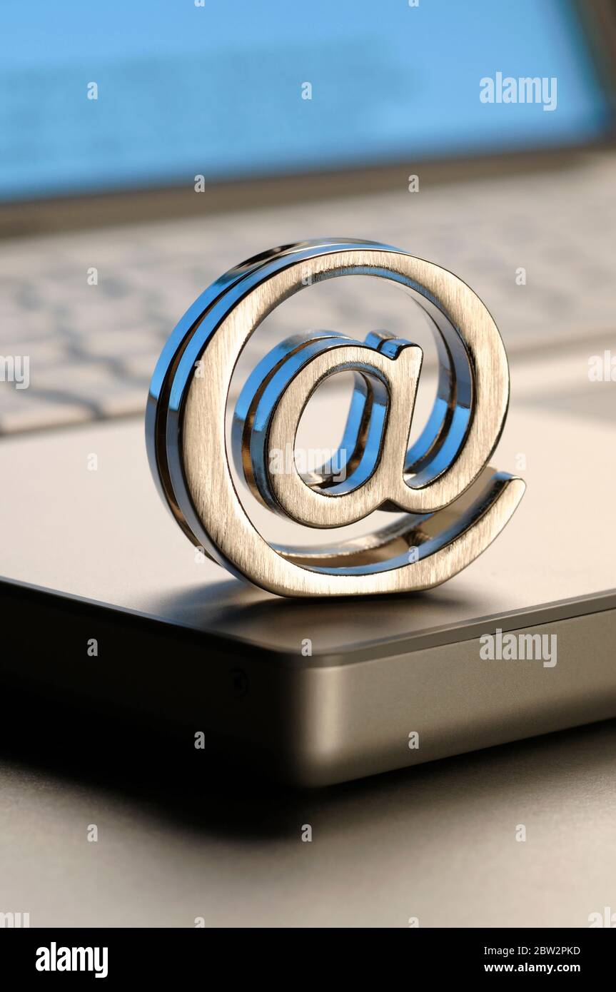 An at symbol on the corner of a laptop computer Stock Photo - Alamy