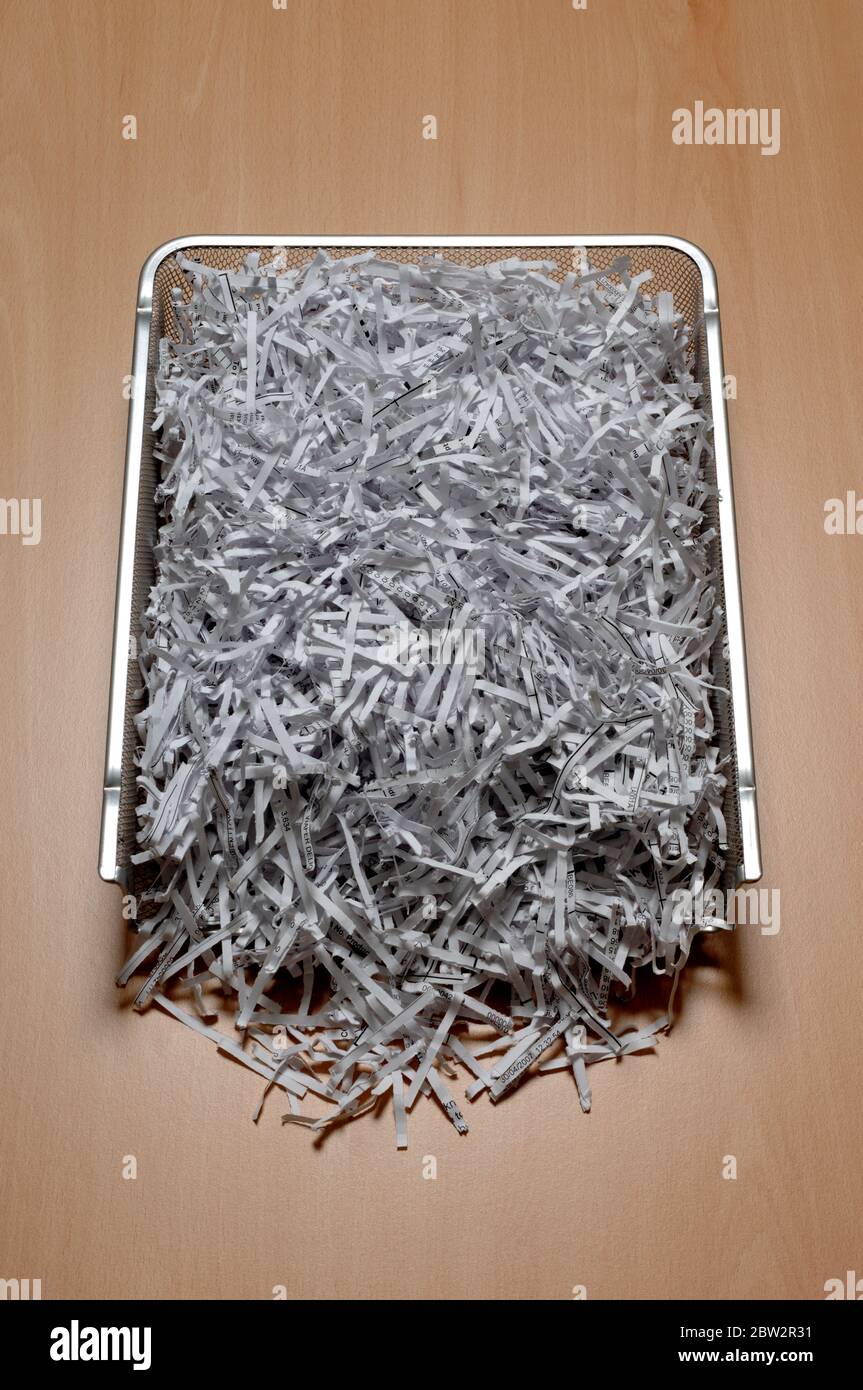 An office in tray filled with shredded paper Stock Photo - Alamy