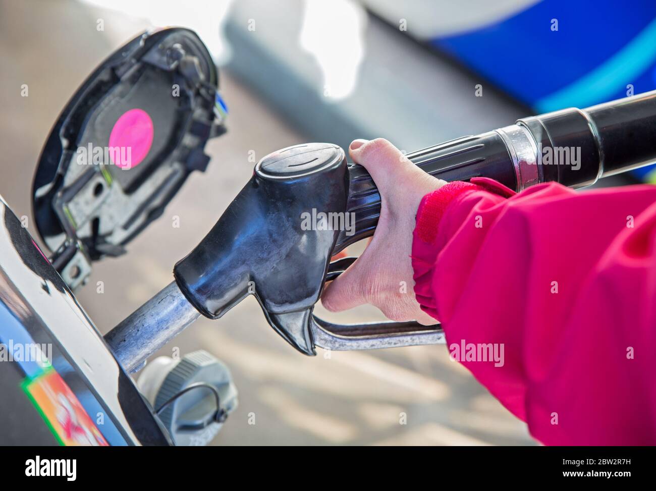 Woman putting diesel fuel hi-res stock photography and images - Alamy