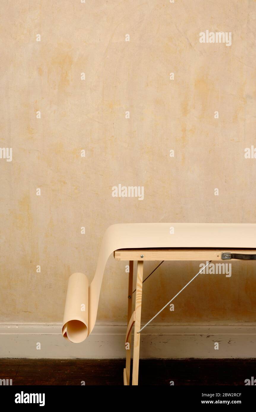 A roll of wallpaper on a pasting table Stock Photo - Alamy