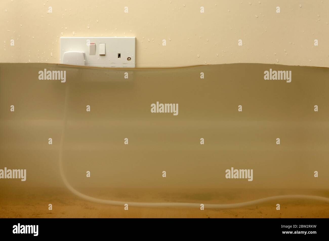 Flood water over an electrical socket Stock Photo - Alamy