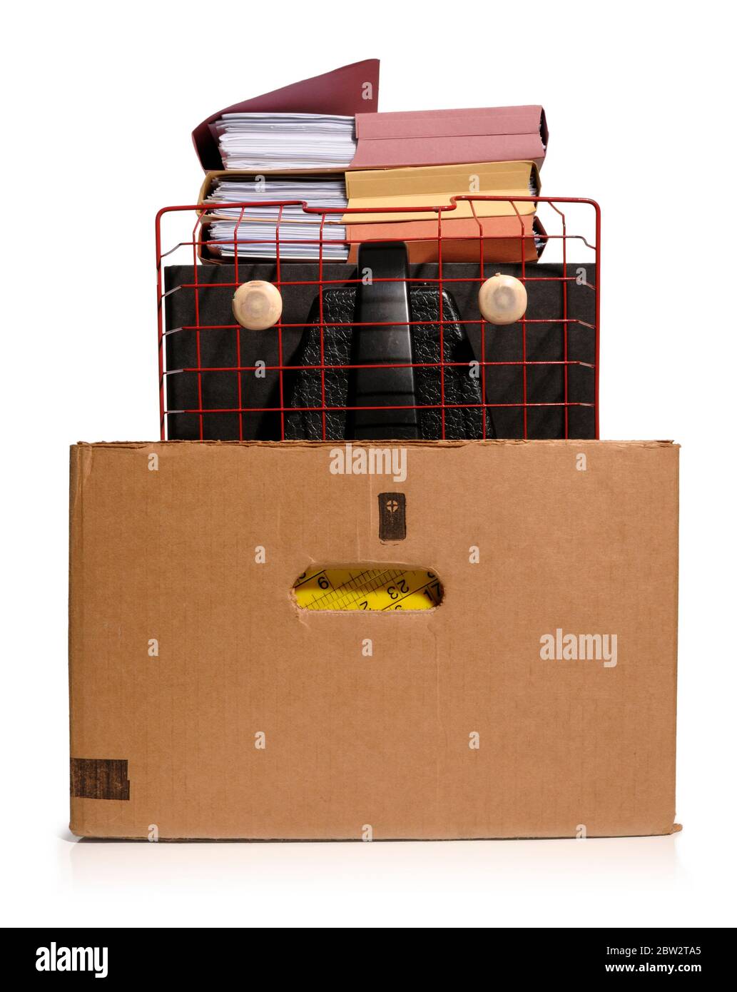 A cardboard box filled with office items Stock Photo - Alamy