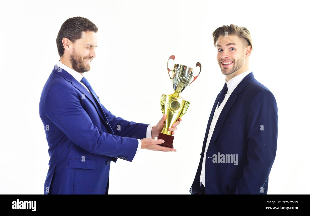 Businessman with cheerful face receives golden prize. Awarded best ...