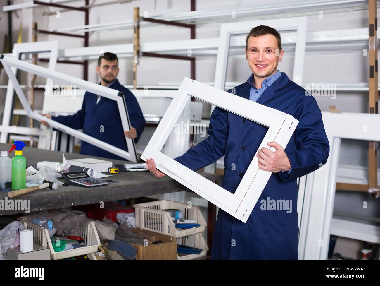 Production happy workers in coverall with different finished PVC ...