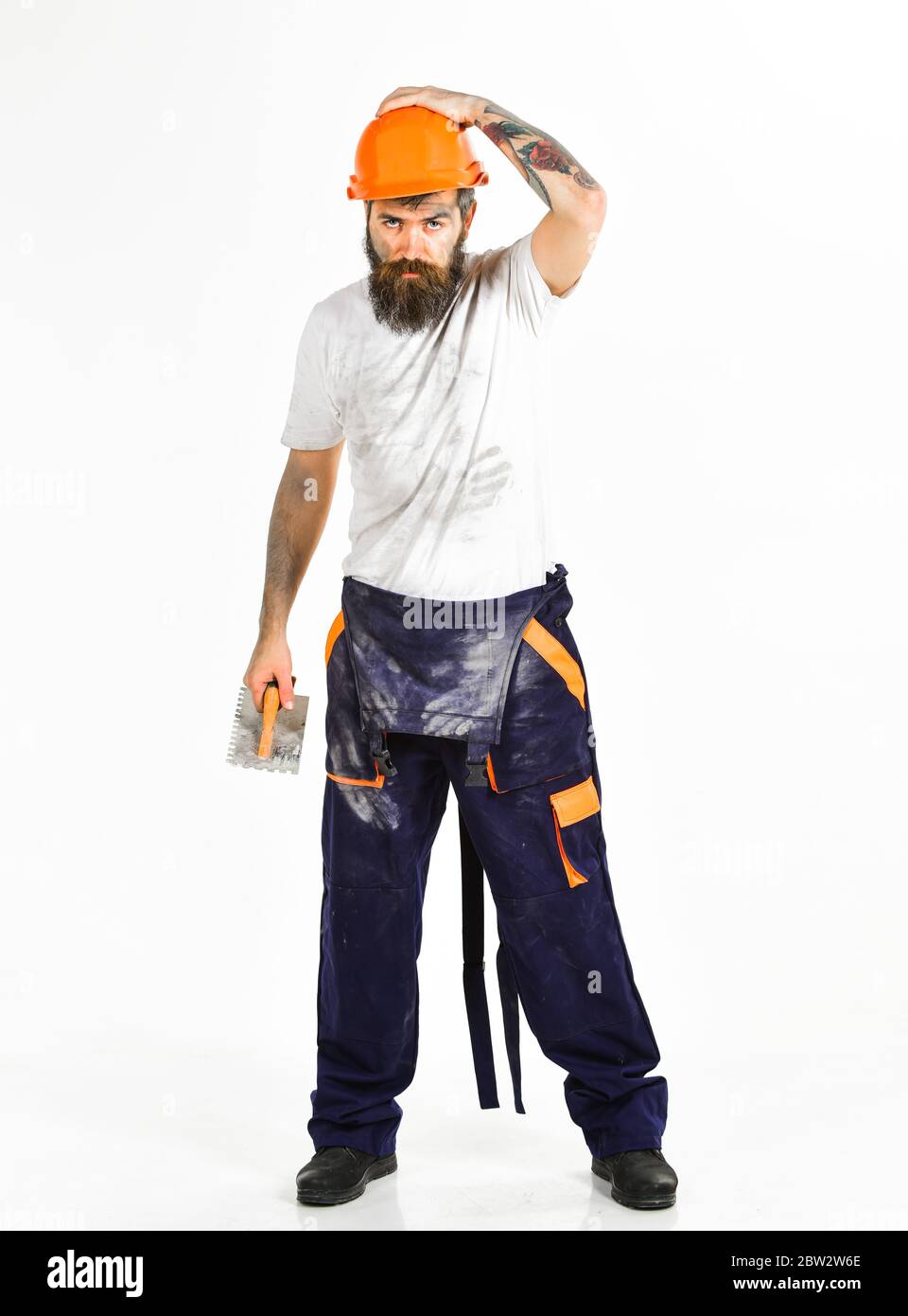 Repairman at work concept. Bearded repairman on serious face and dirty ...