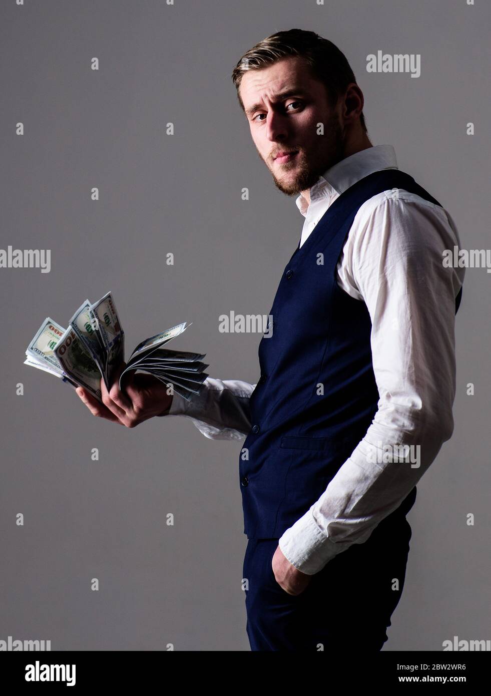 Rich man, successful entrepreneur get cash, banknotes, currency ...