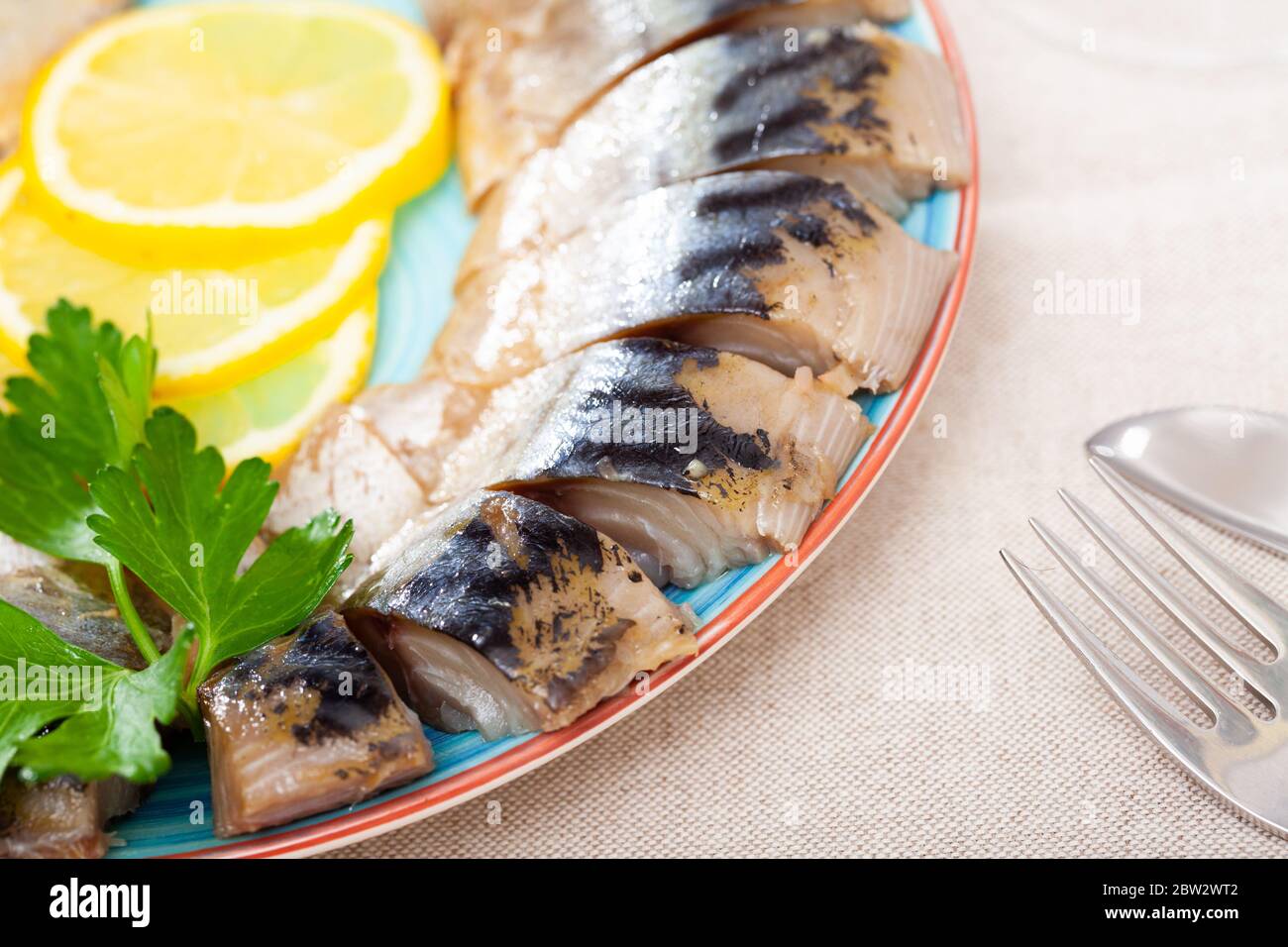 Fragrant smoked mackerel skinless fish sliced and garnished with ...