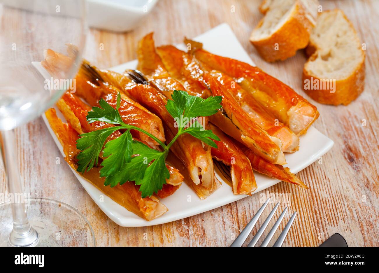 Cold smoked salmon belly strips. Popular fish product of Russian ...
