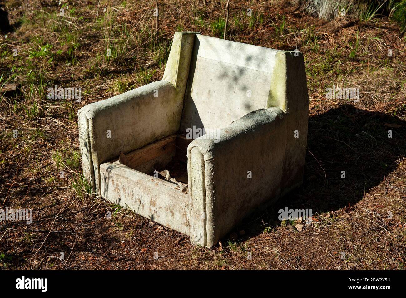 worn abandoned chair without seat in rural landscape in summer Stock ...