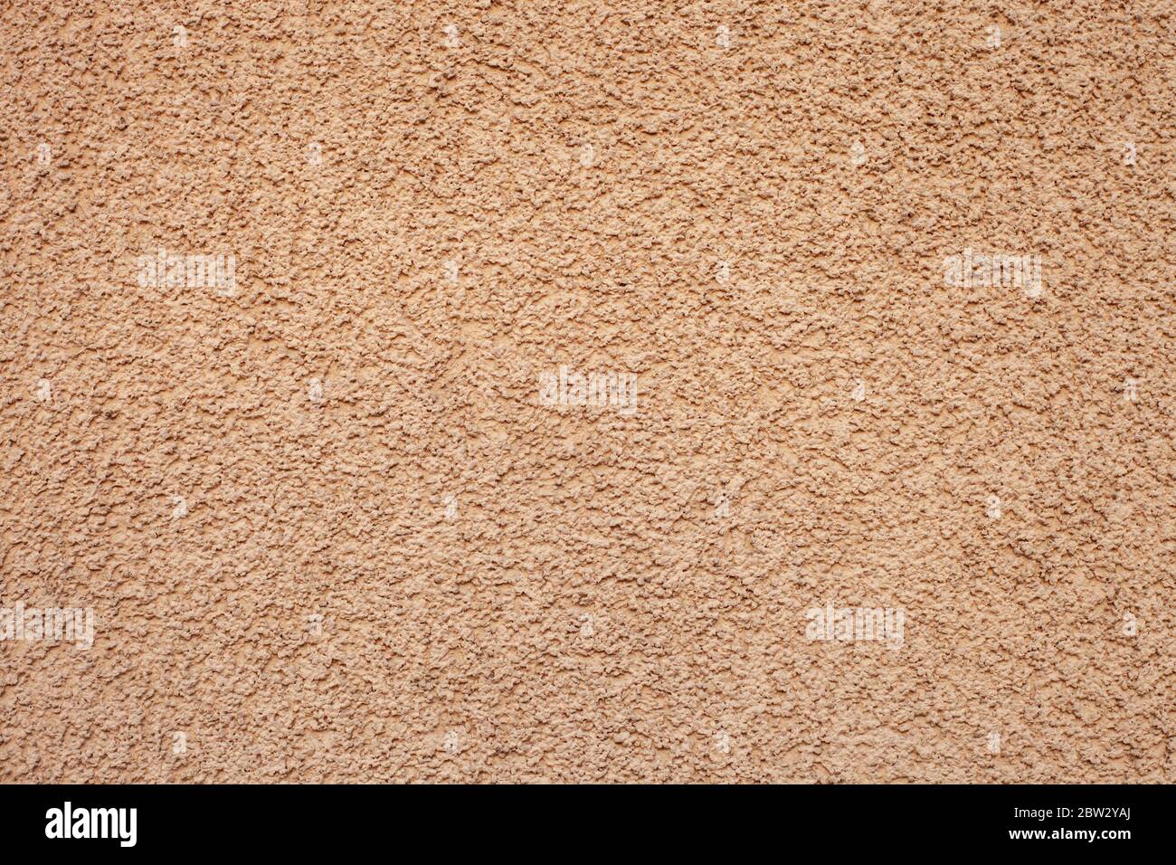Texture yellow pebble dash stucco facade. House wall orange grainy ...