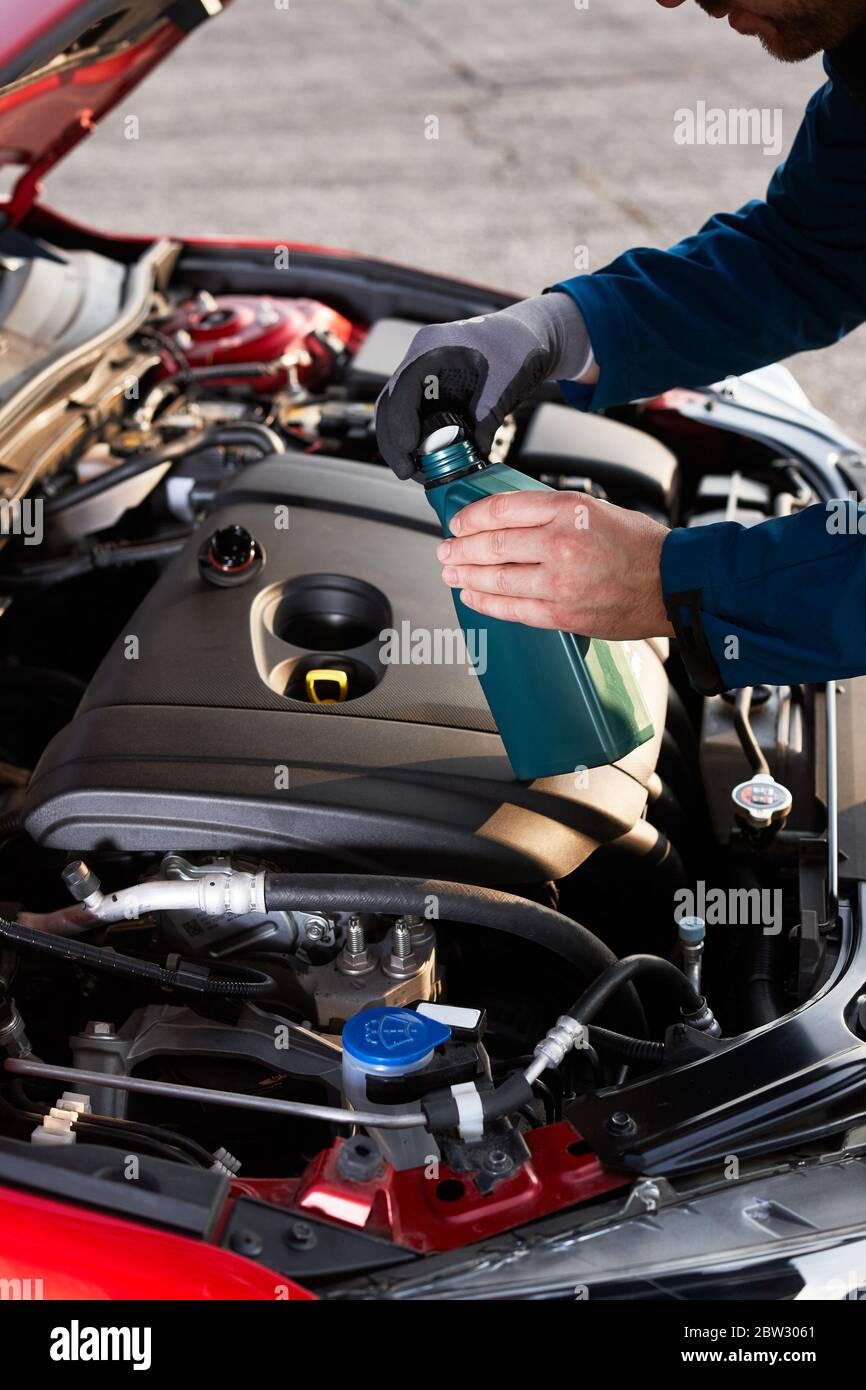 Motor oil refilling hi-res stock photography and images - Alamy