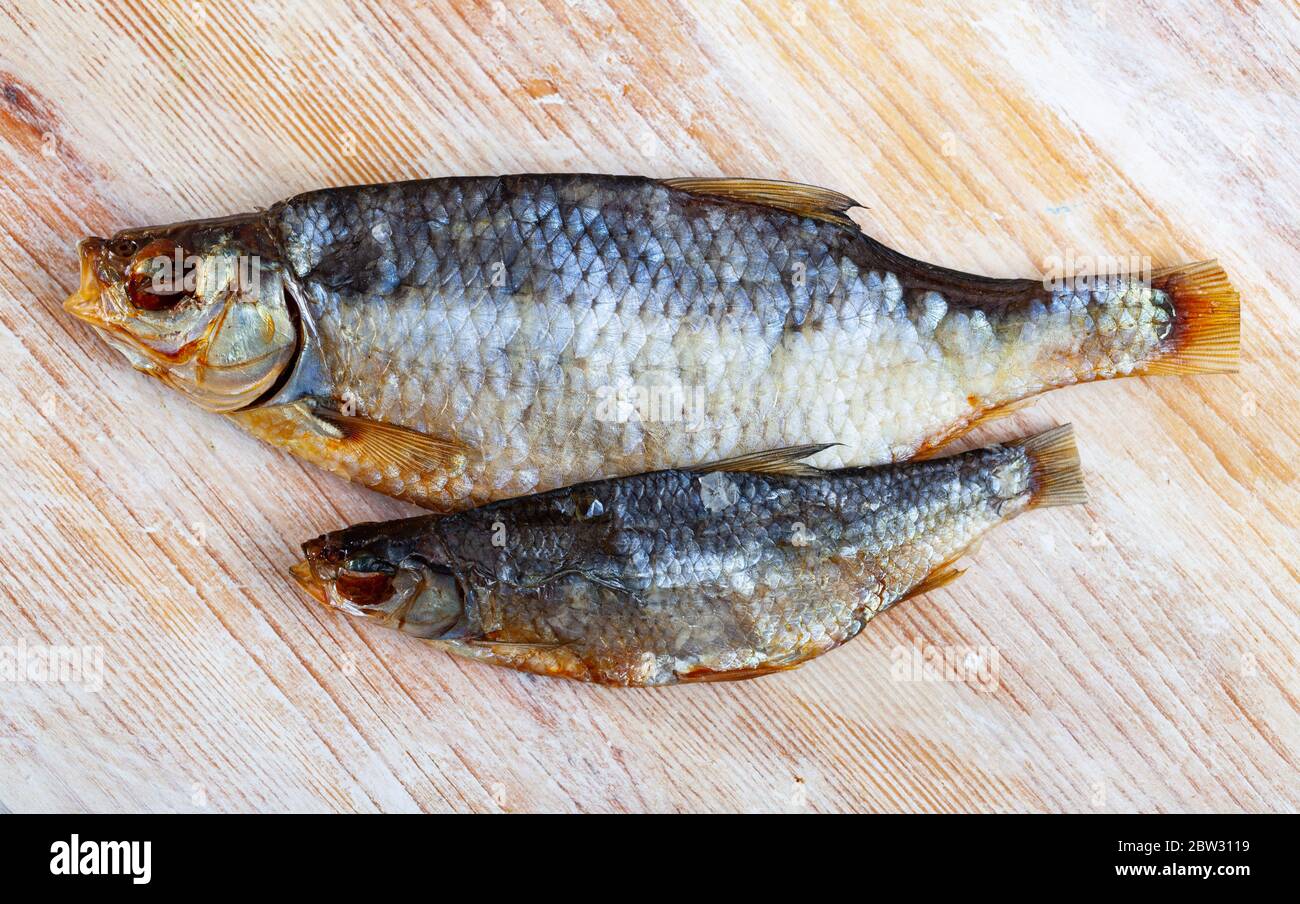 Air-dried salted roach fish on wooden background, russian cuisine Stock ...