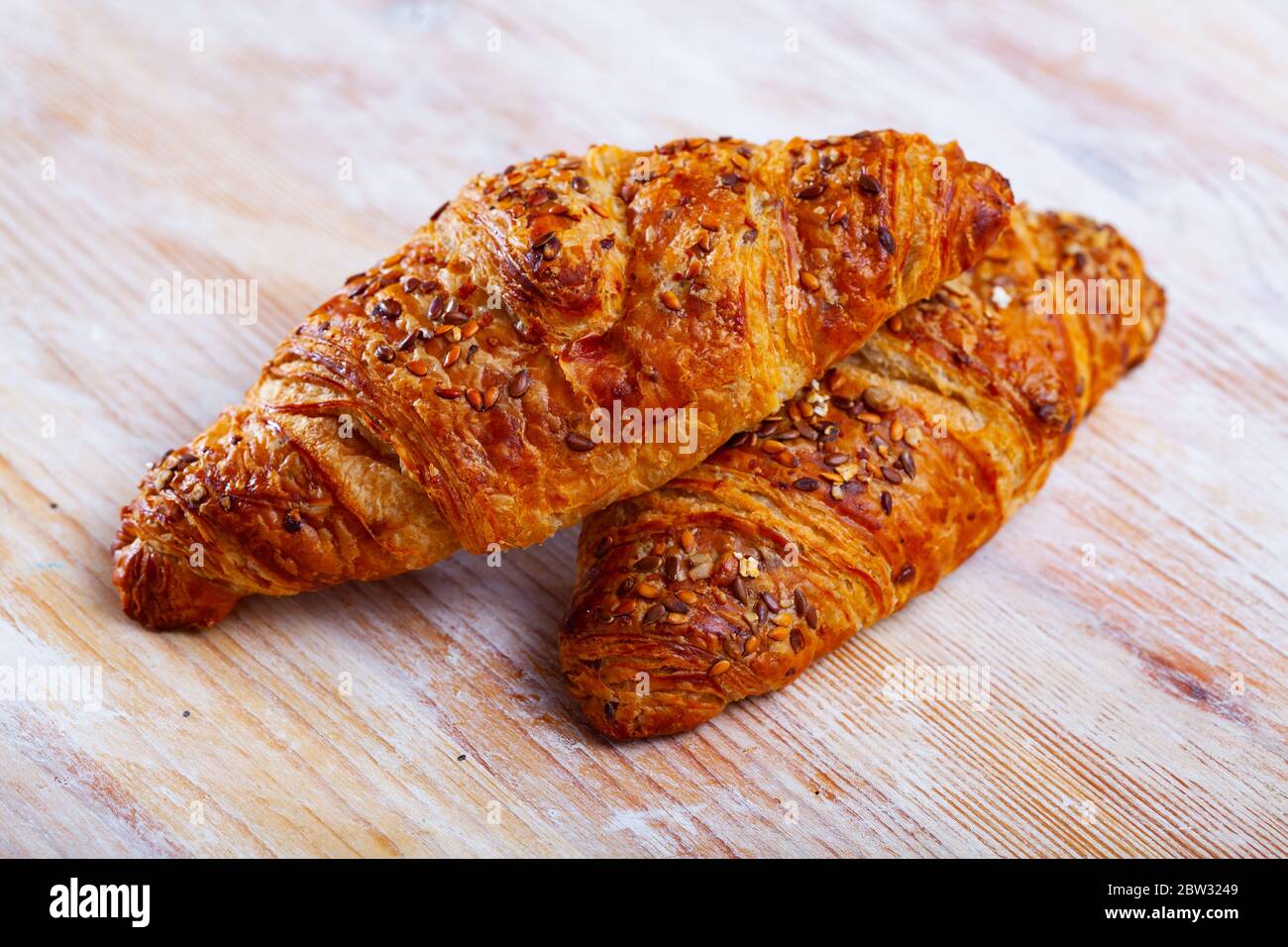 Image of fresh multigrain croissants, spanish dessert on wooden table ...