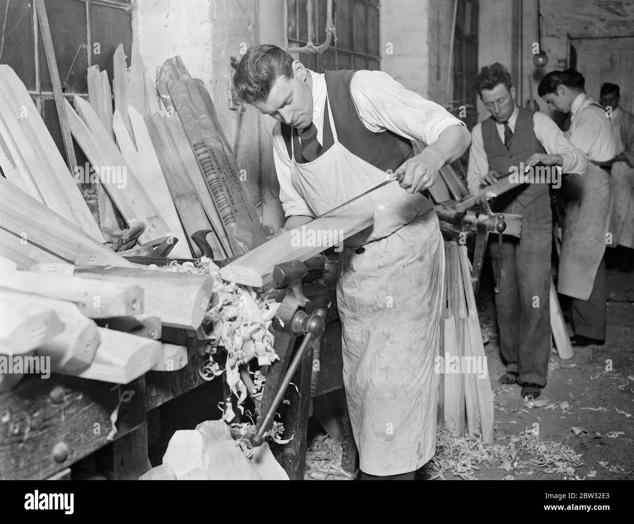 Shaping bats for coming cricket season . Hundreds of workmen are busy ...