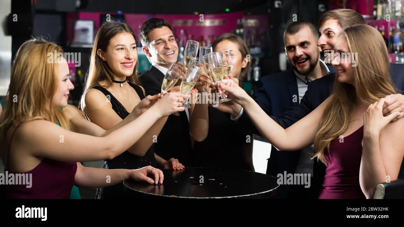 Happy colleagues dancing on corporate party with cocktails Stock Photo ...
