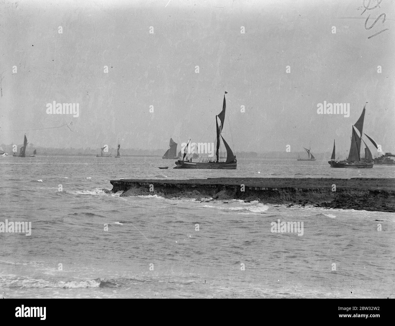 Sailing barges race down the Thames . Sailing barges used on the Thames ...