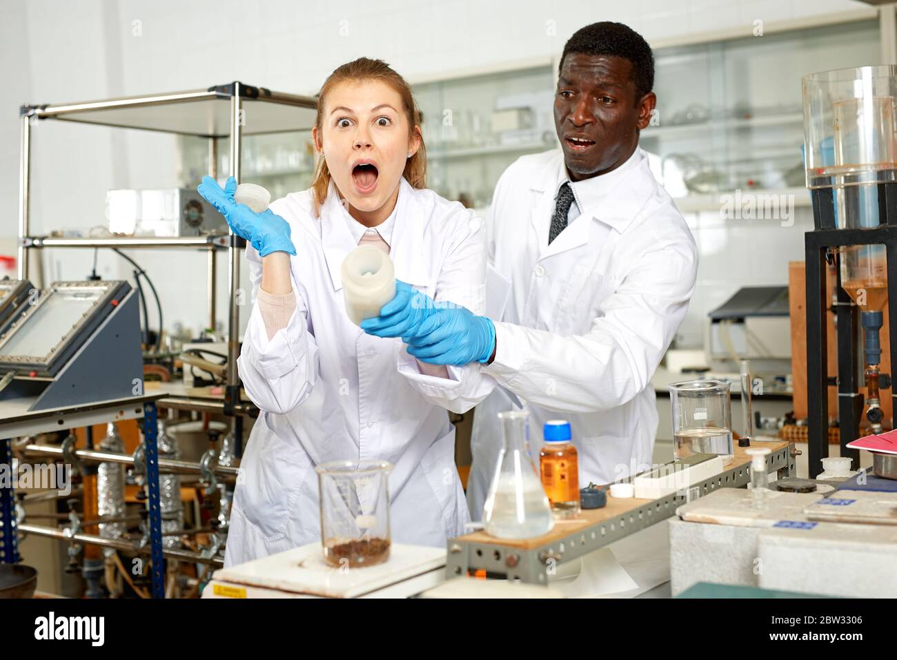 Worriend and scared male and female scientists after chemical ...