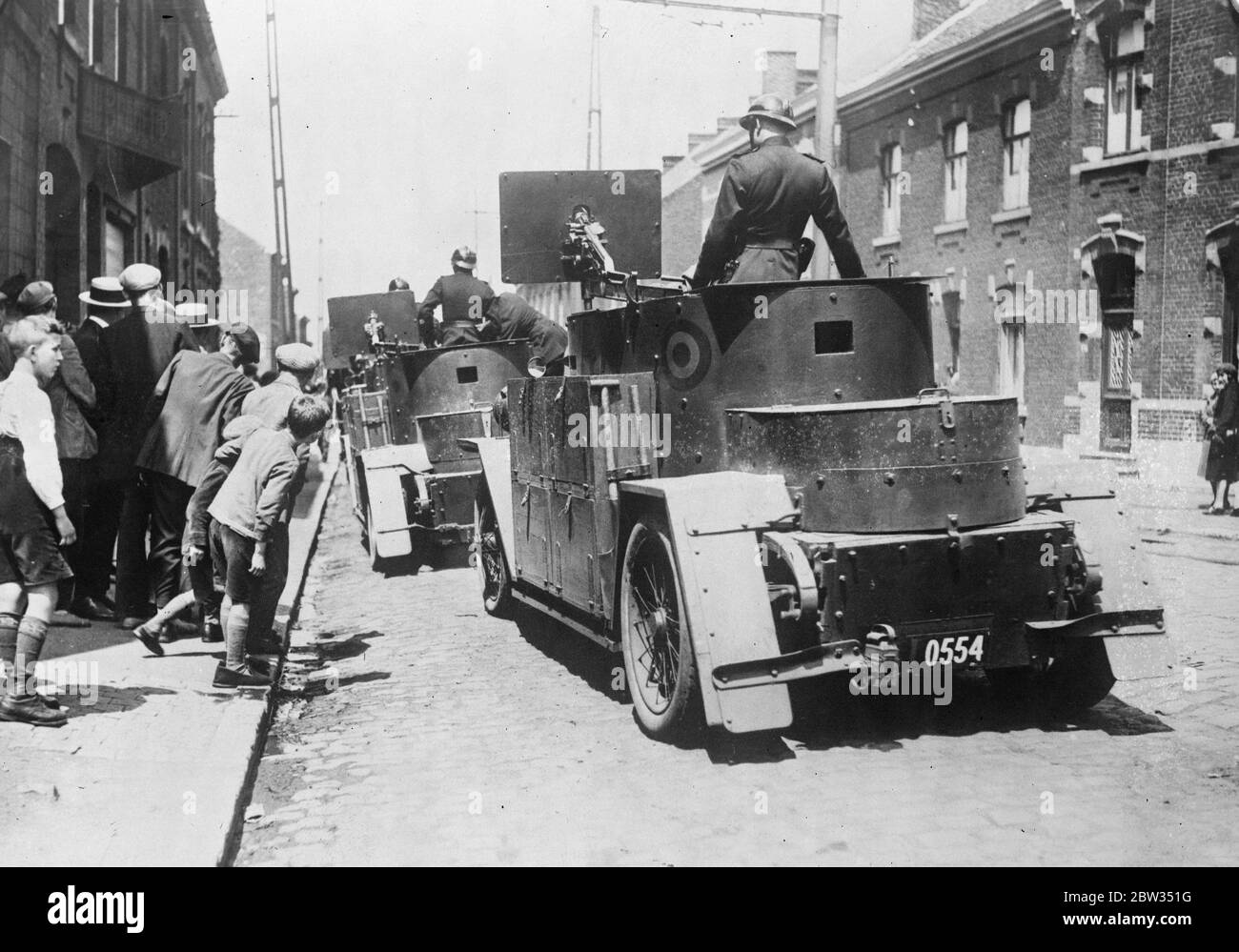 Serious rioting in Belgian coal fields , armoured cars patrol streets ...