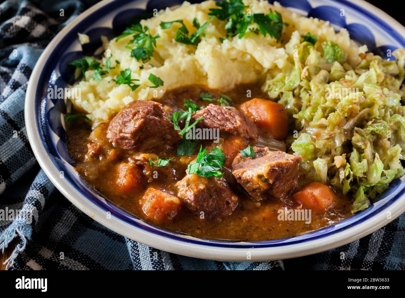 Traditional irish stew served with mashed potatoes and cabbage Stock ...