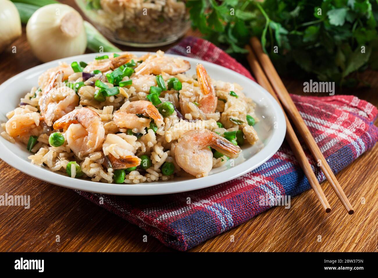 Fried rice with shrimp and vegetables served on a plate. Popular ...