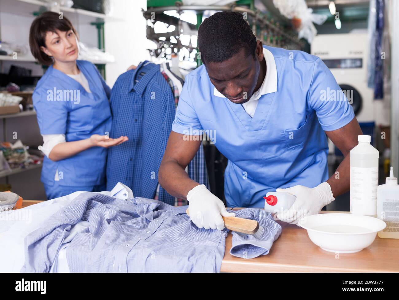 Portrait of skilled African male laundry worker during daily work Stock ...