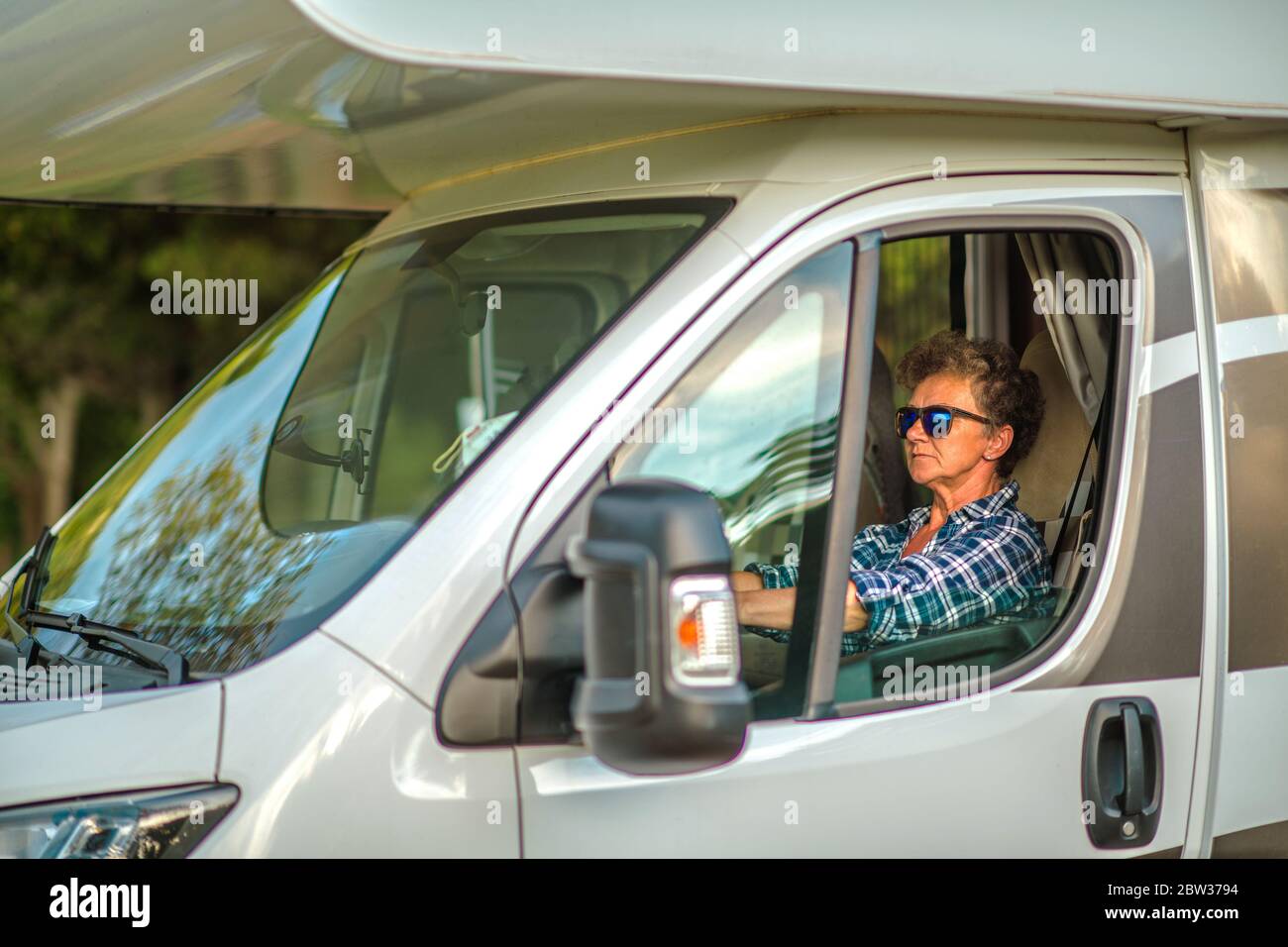 Vacation Road Trip in the Motorhome. Caucasian Woman in Her 60s Driving ...