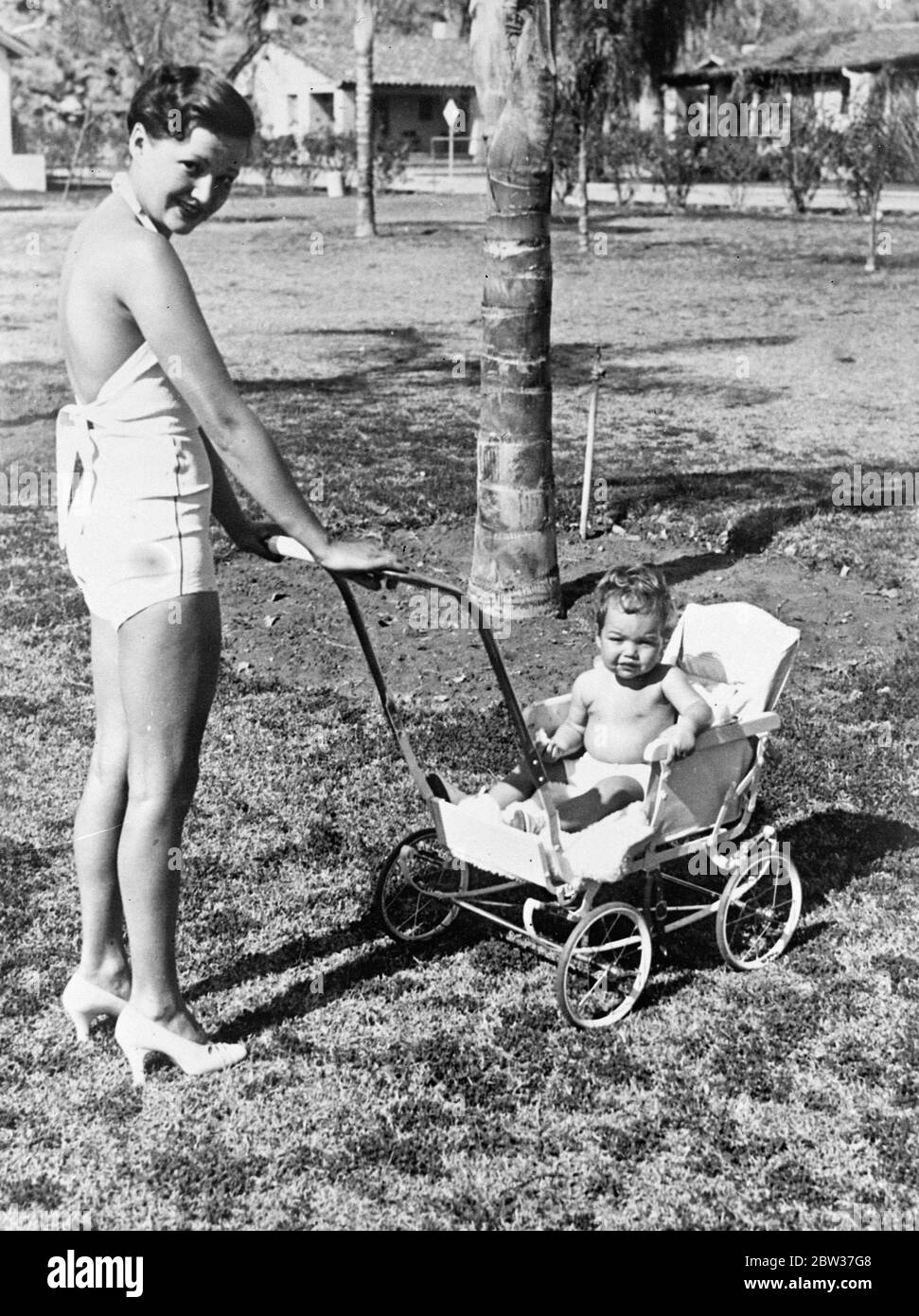 Arlene Judge takes baby for a ride in the Californian sunshine . Mrs ...
