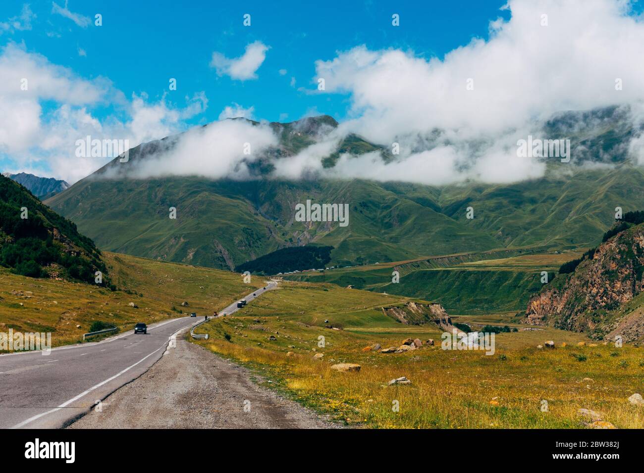The single-lane highway through the mountainous Kazbegi region ...