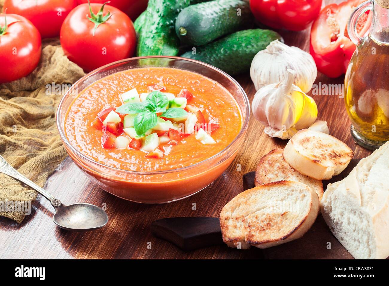 Spicy homemade gazpacho soup served with jamon ham. Traditional spanish ...