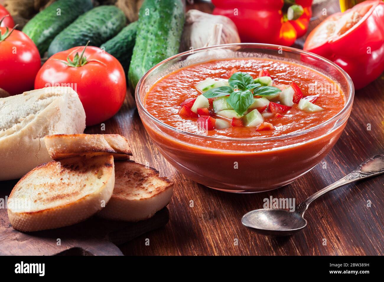 Spicy homemade gazpacho soup served with jamon ham. Traditional spanish ...