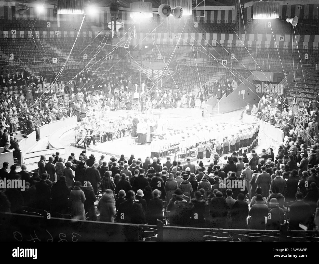 Church service in Olympia circus ring . Lion tamers , trapeze ...