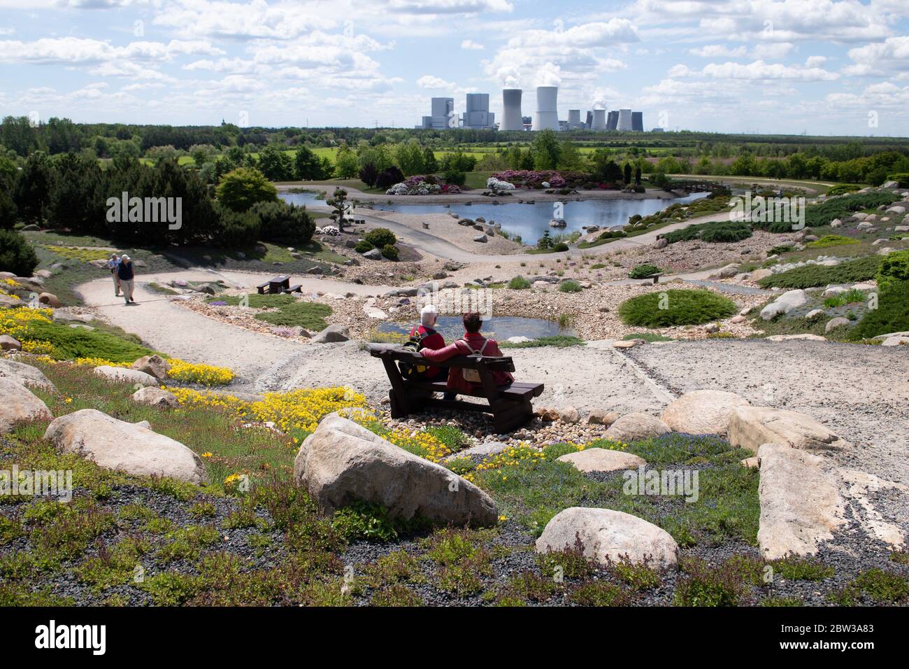 Boxberg, Germany. 29th May, 2020. Visitors sit on a bench in the ...