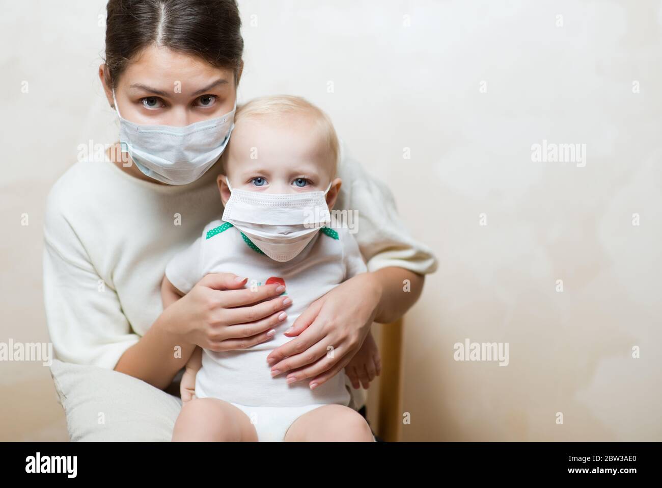 mother and her little daughter in medical masks Stock Photo - Alamy