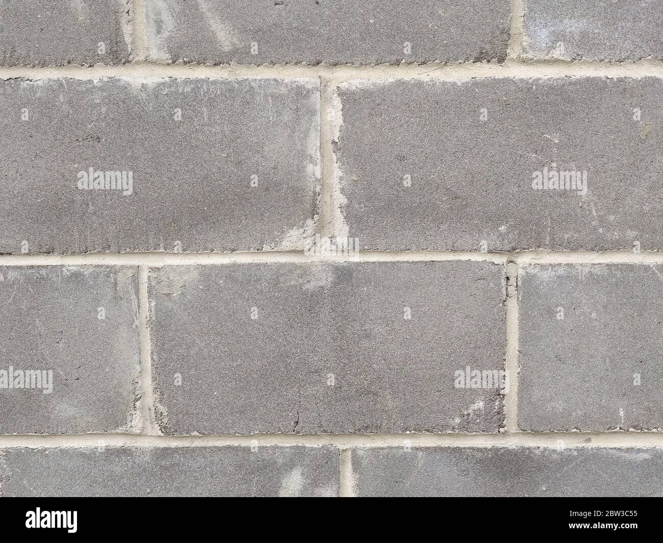 Close up Texture of a strong gray wall of concrete blocks. Background ...