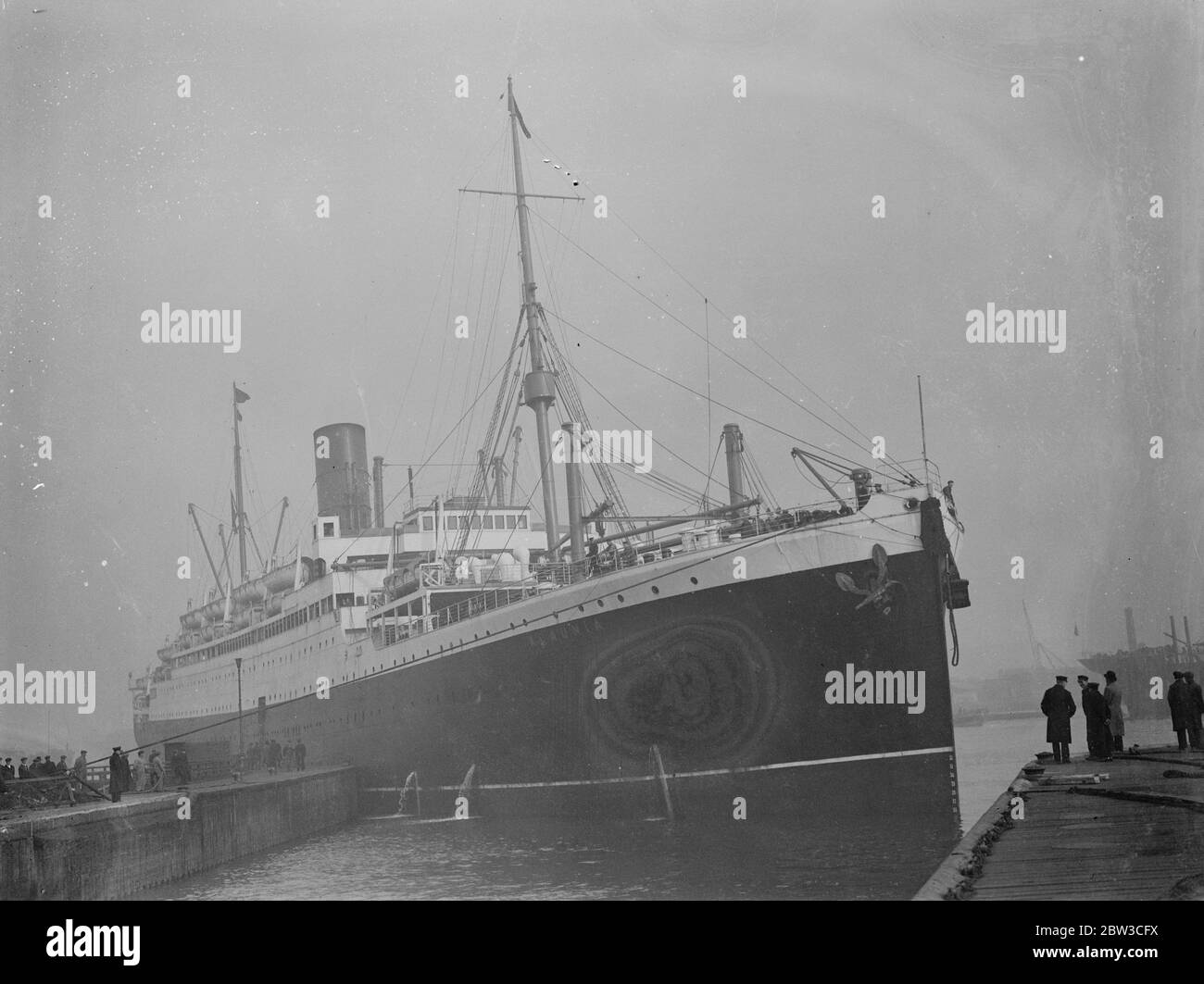 The Cunard liner , Alaunia entering docks after being stranded in fog ...