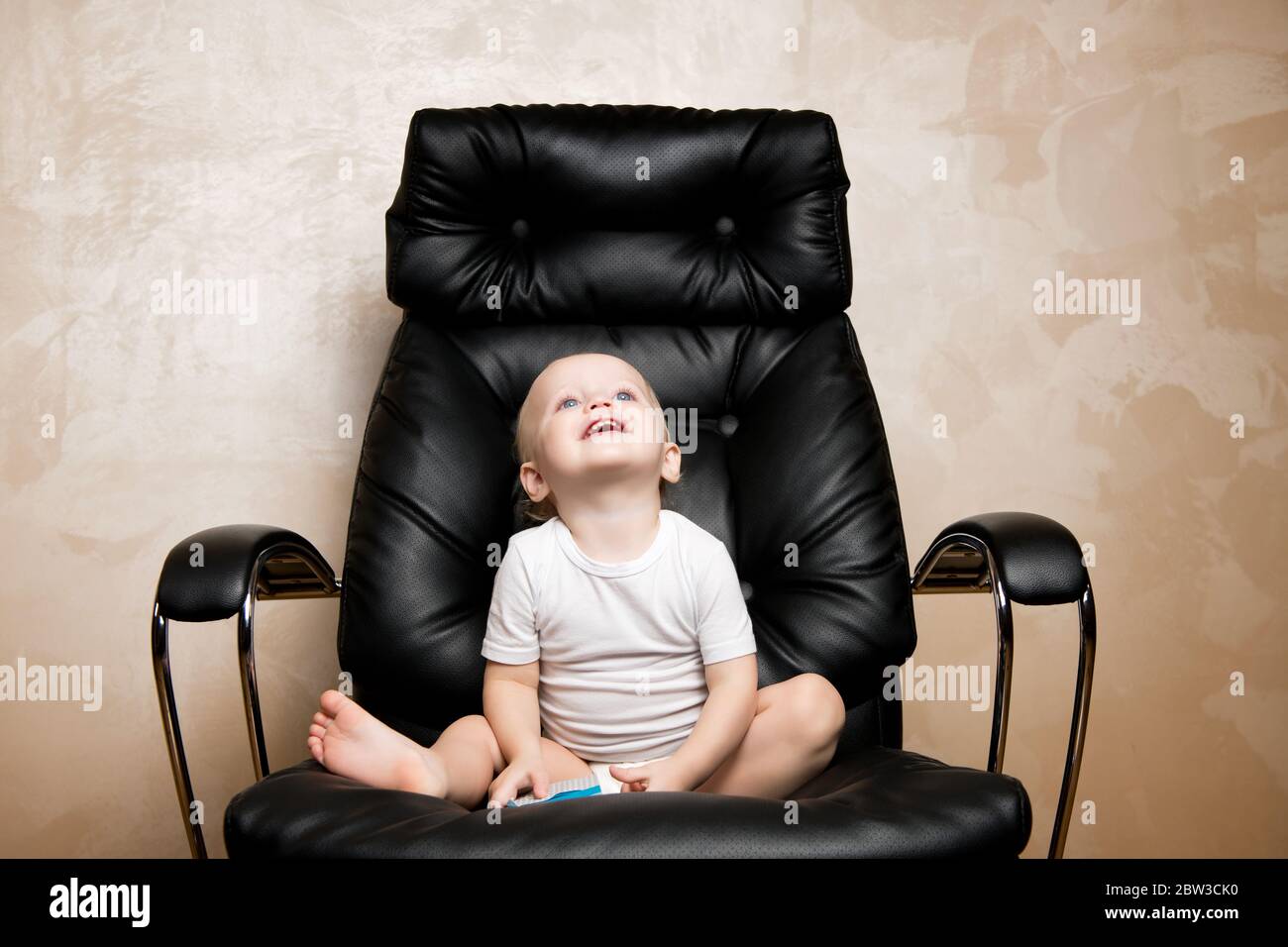 Small person large chair hi-res stock photography and images - Alamy