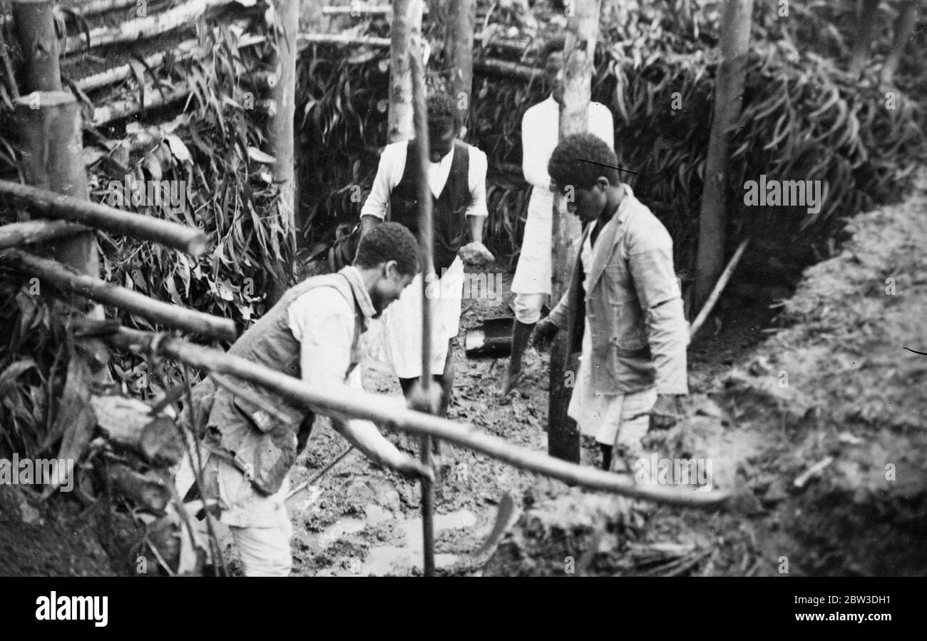 Schoolchildren dig bomb proof shelters at Addis Ababa mission . Boys of ...