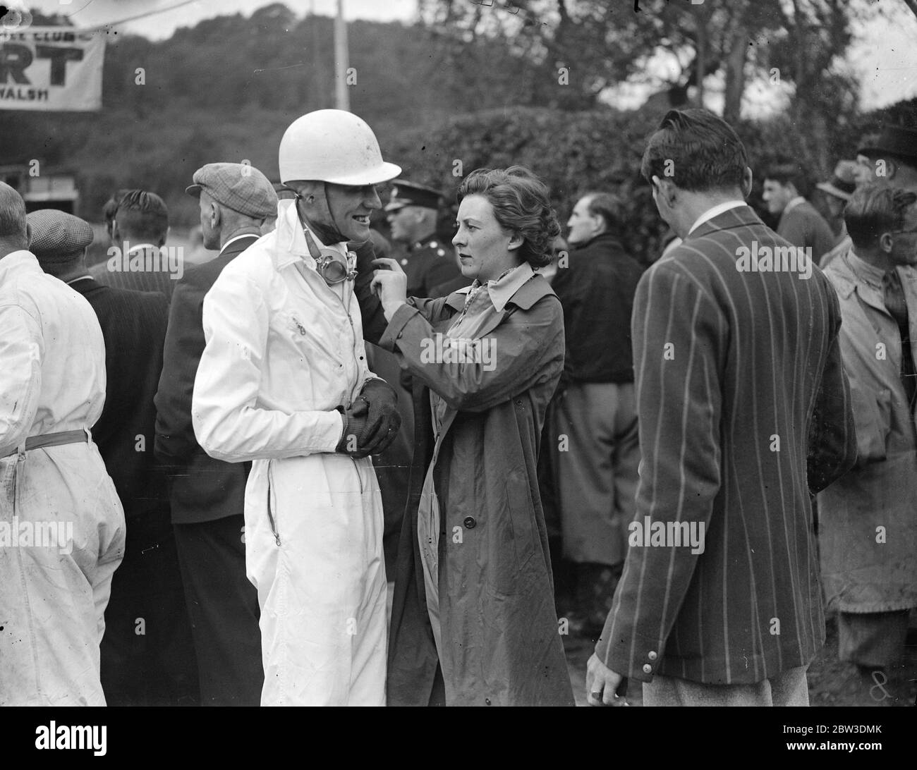 Miss Doreen Evans assists her brother K D Evans who drove an MG with ...