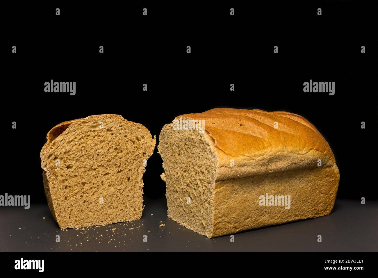 Loaf Of Partially Sliced Honey Wheat Bread Stock Photo - Alamy