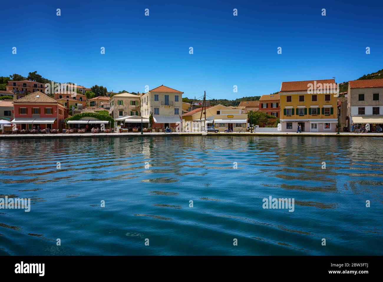 Paxos Island, Greece. View of beautiful Loggos Harbor sea bay with calm ...
