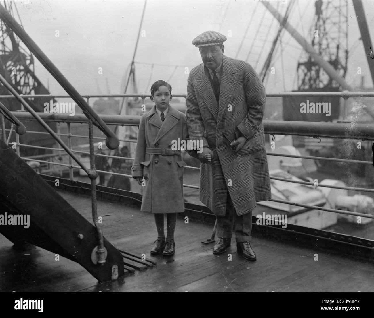 8 year old Billy Wallace shakes hands with his father as he sails on ...
