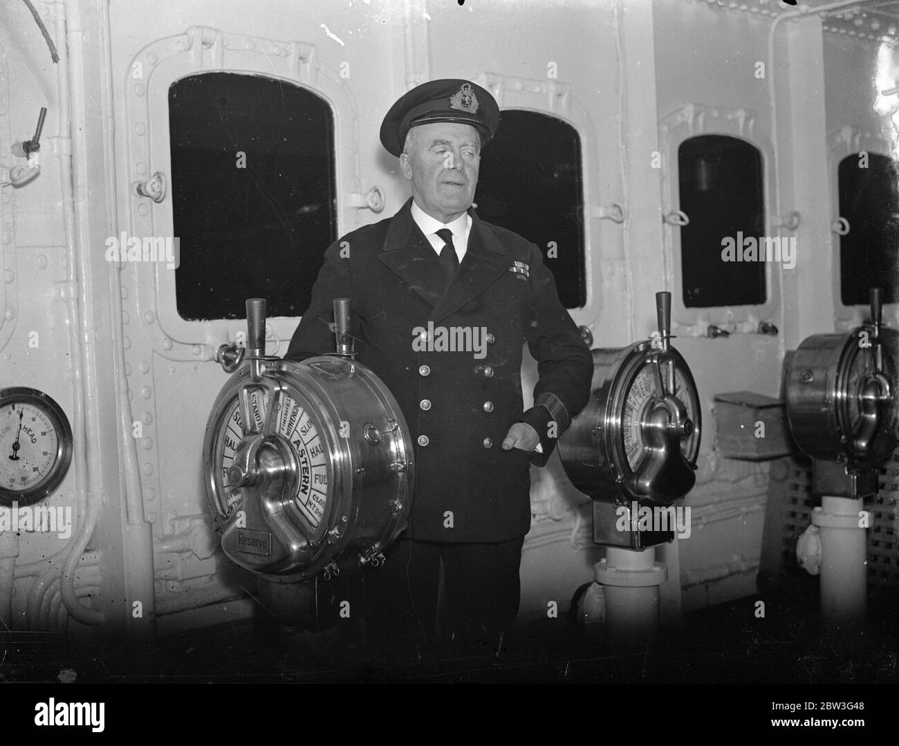 Queen Mary 's commander arrives in London . Captain Sir Edgar Britten ...