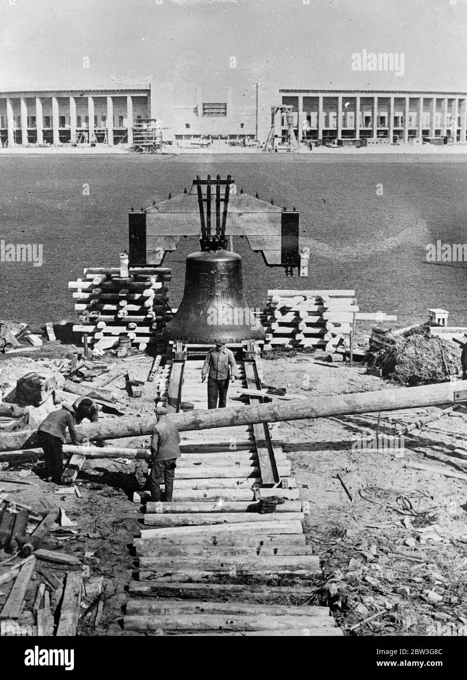Putting Olympic bell into 250 feet tower at new Stadium . The difficult ...