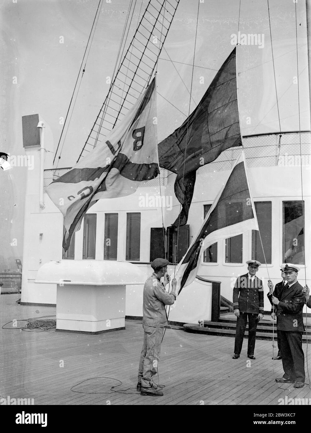 Queen Mary , handed over to Cunard White Star at Southampton , flies ...