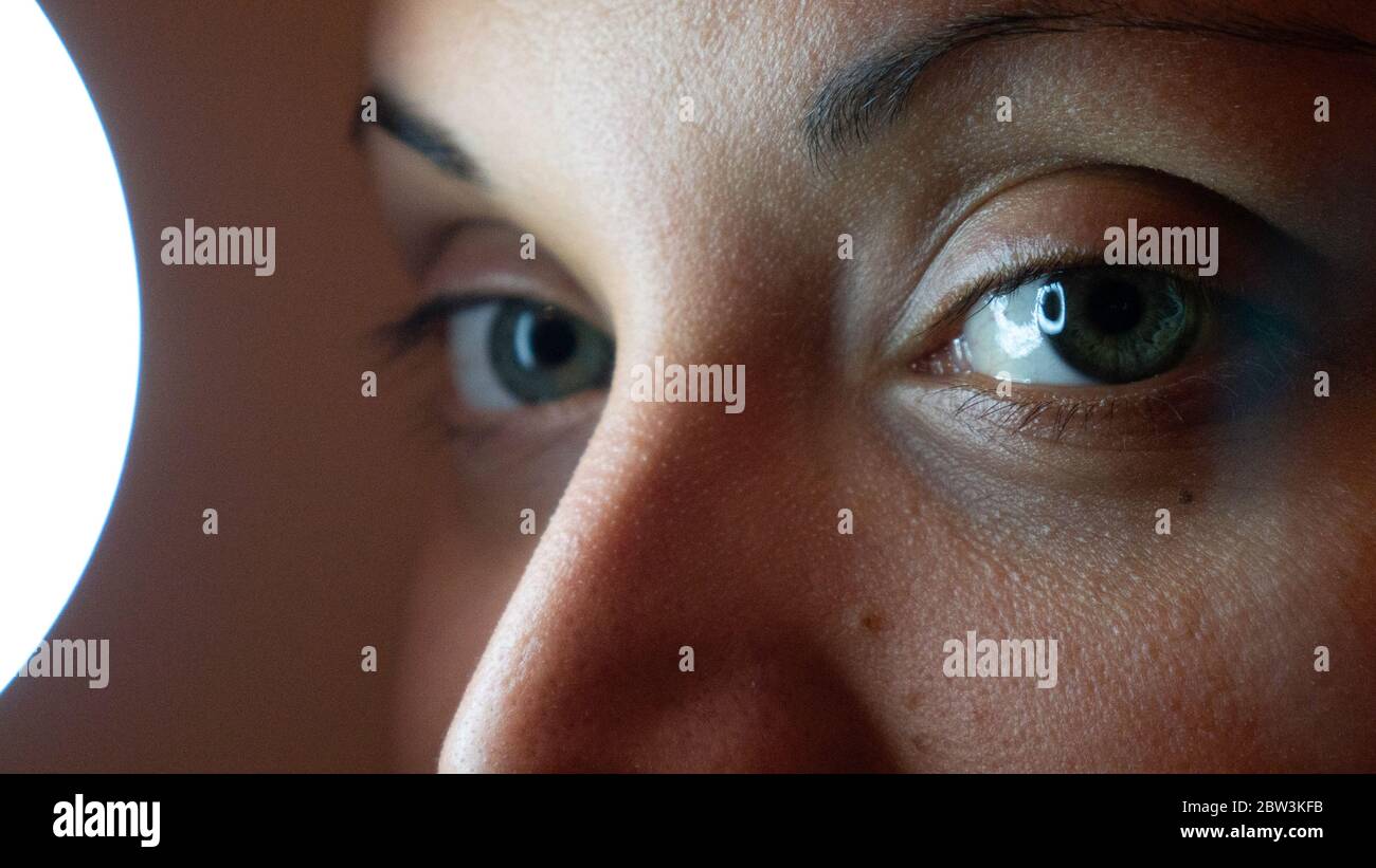 Radiation of the eyes with light Stock Photo - Alamy