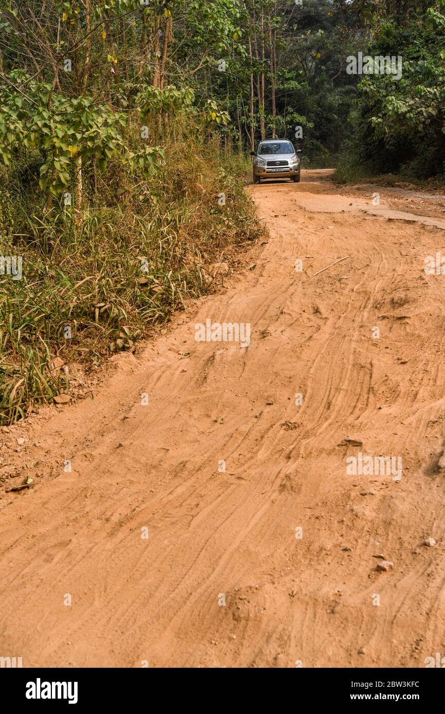 Africa, West Africa, Togo, Kpalime. An off-road vehicle is driving on a ...