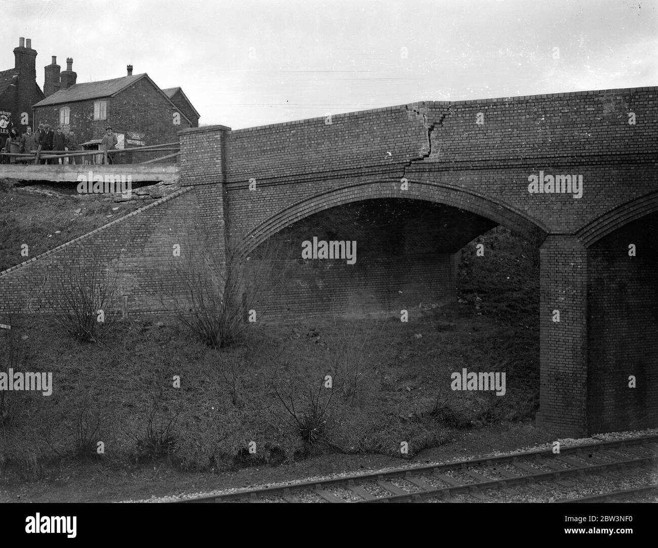 Devizes bridge collapsing through heavy rains . Great cracks in roadway ...