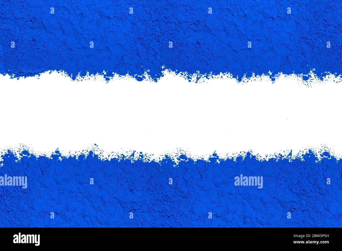 Abstract background of blue dry powder paint. Copy space in a white ...