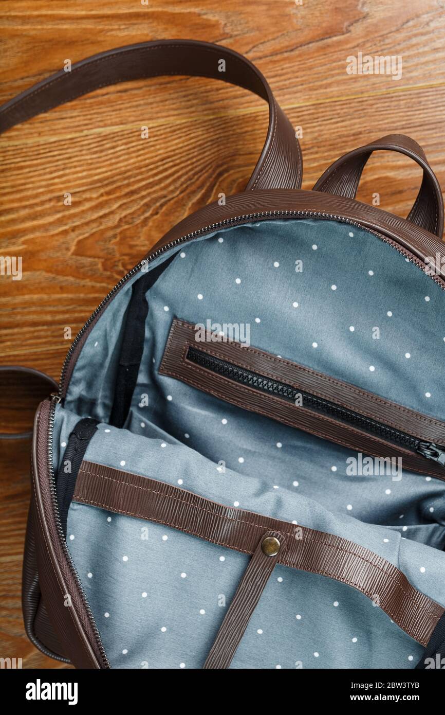 An empty handmade genuine leather backpack is open for things Stock ...